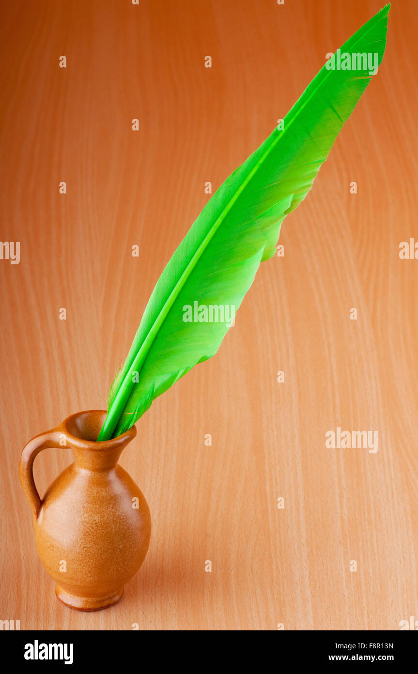 Writing feather against gradient background Stock Photo - Alamy