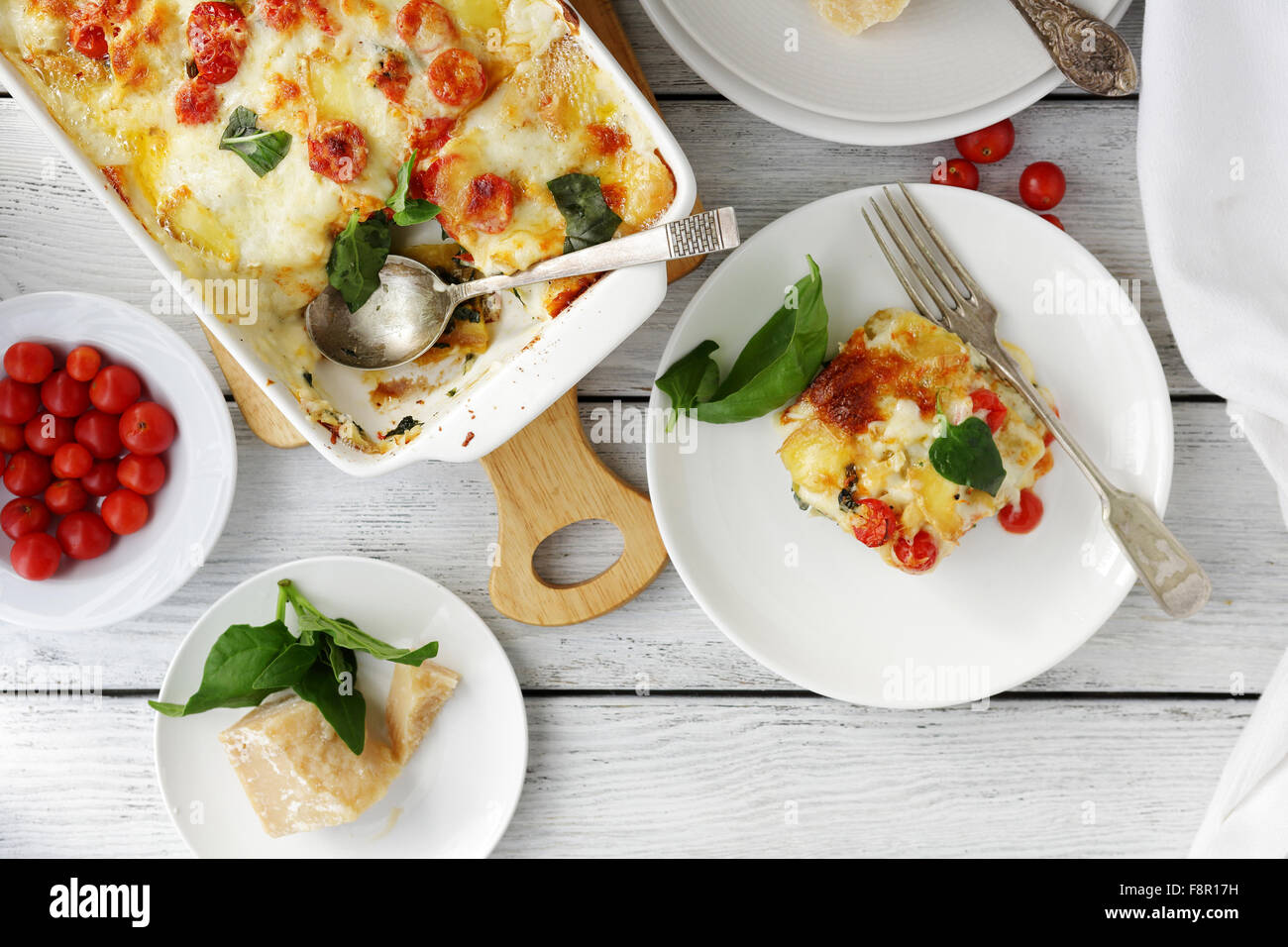 tasty lasagna with spinach on table Stock Photo - Alamy
