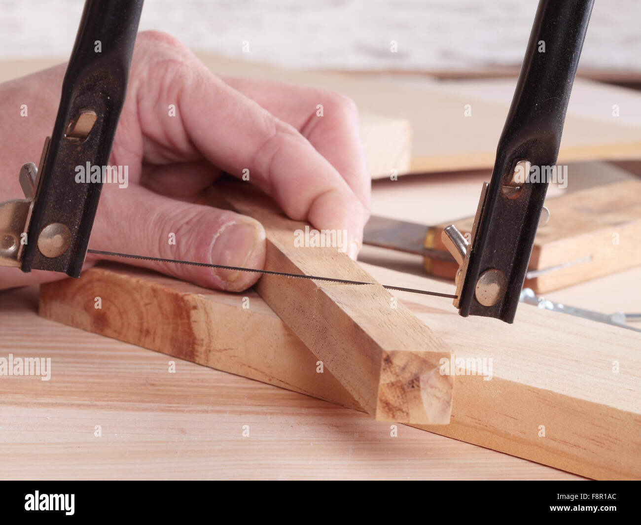 Close-up of man's hand sawing wooden plank.Unrecognizable Stock Photo ...