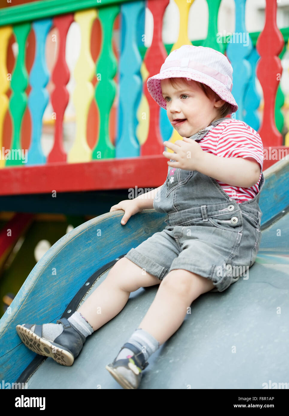 two-year child on slide playground area Stock Photo - Alamy