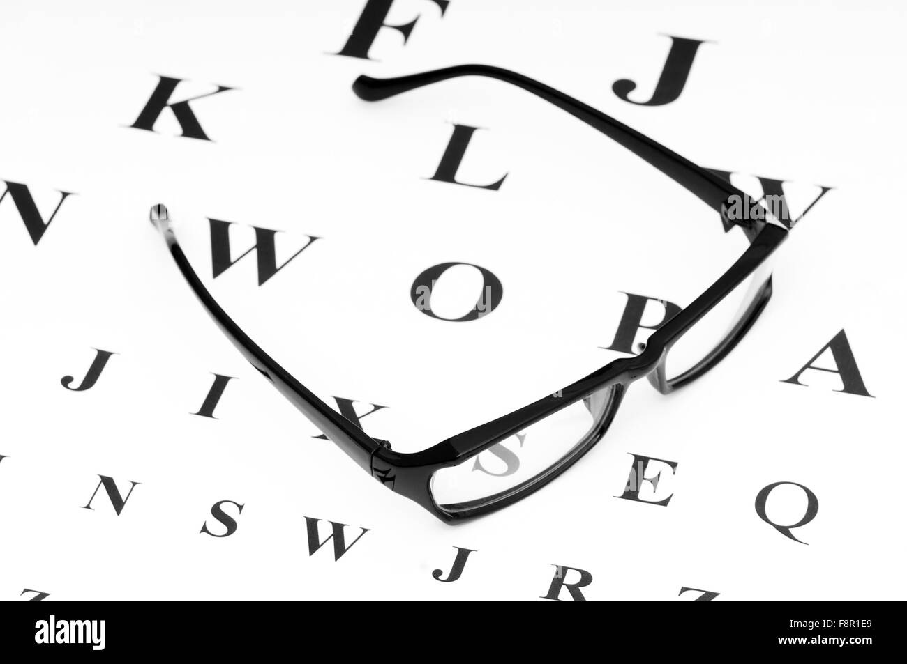 Optical reading glasses on the eyesight table Stock Photo - Alamy