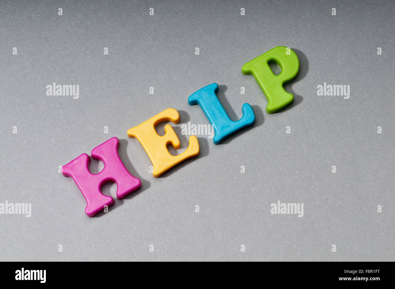 HELP concept with letters on background Stock Photo - Alamy
