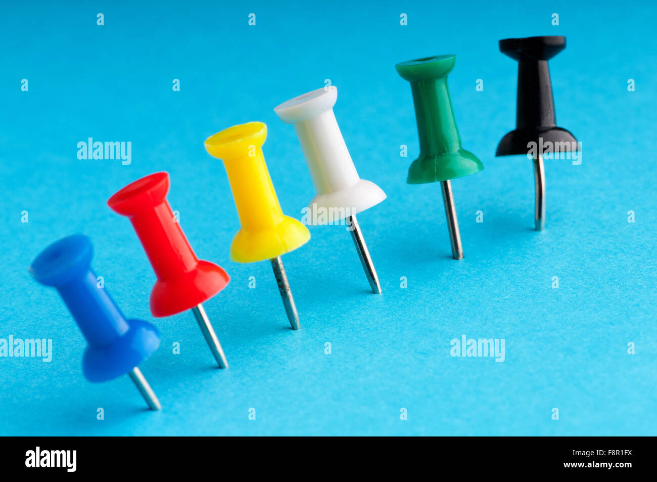 Office pins on the paper Stock Photo - Alamy