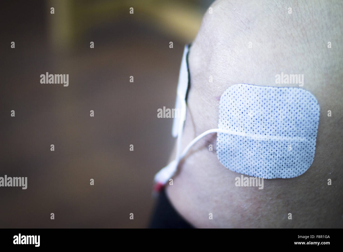 Patient leg and knee in electro physiotherapy electrical impulse ...