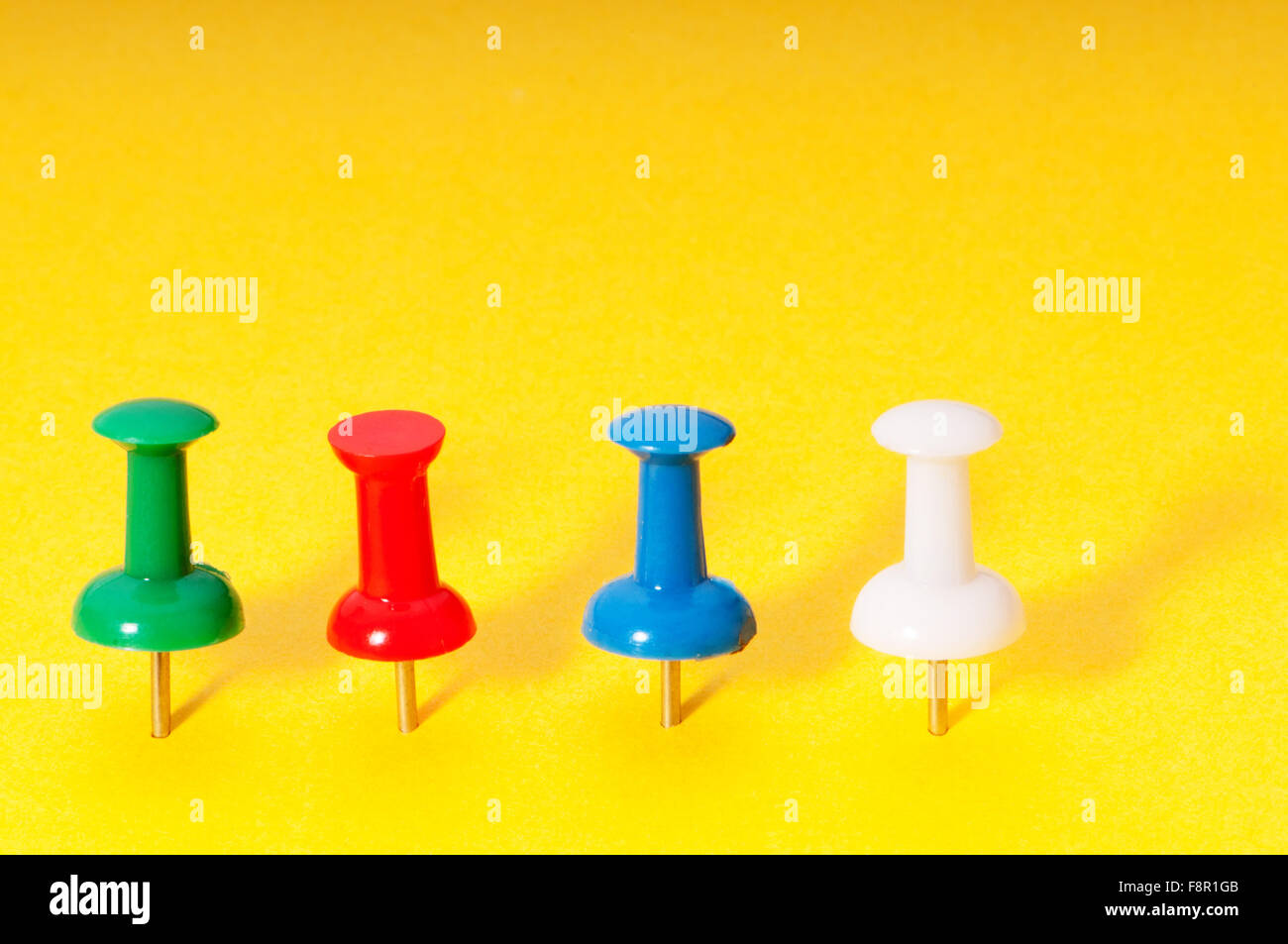 Office pins on the paper Stock Photo - Alamy