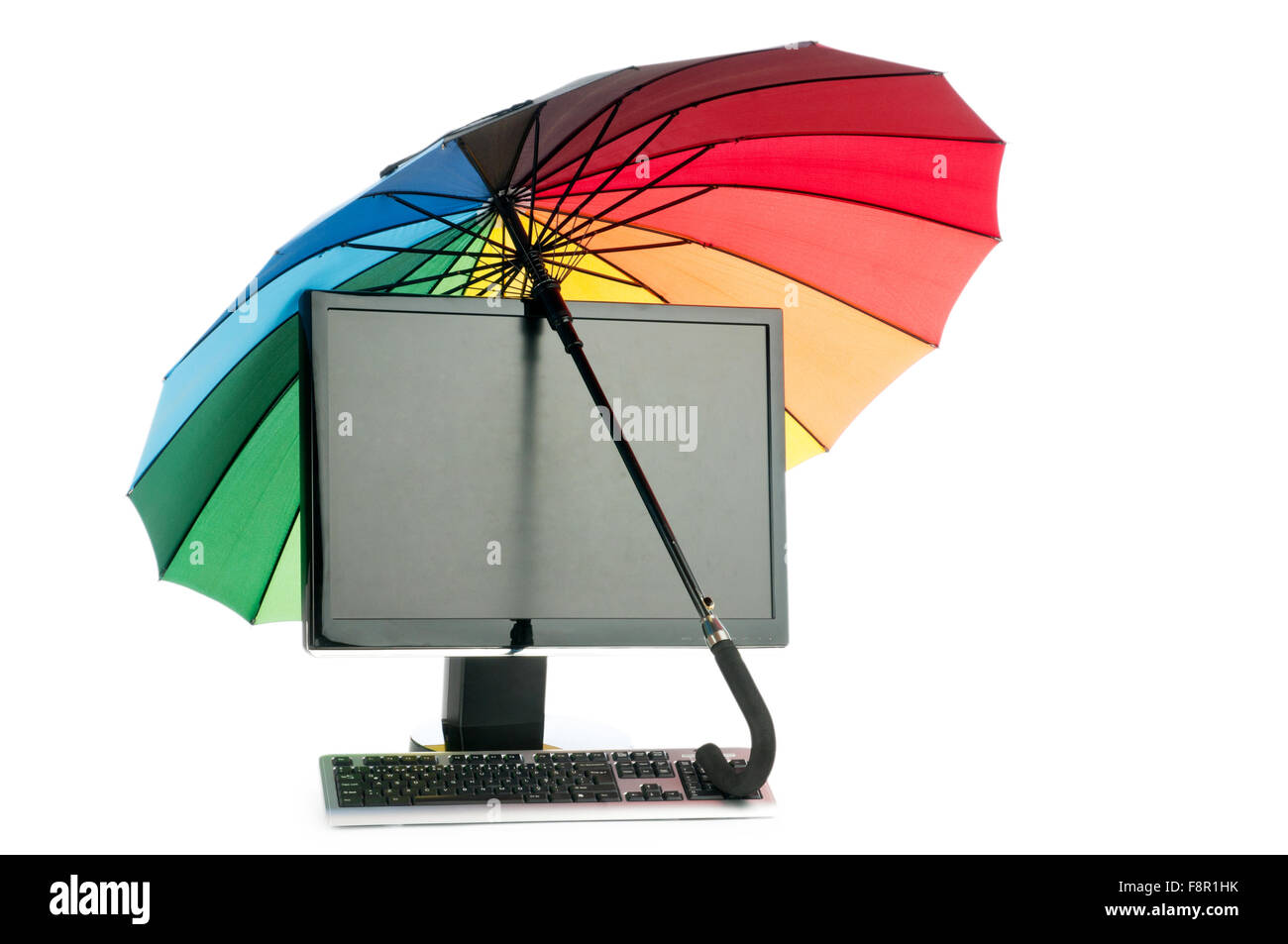 Computer under protection of umbrella Stock Photo - Alamy