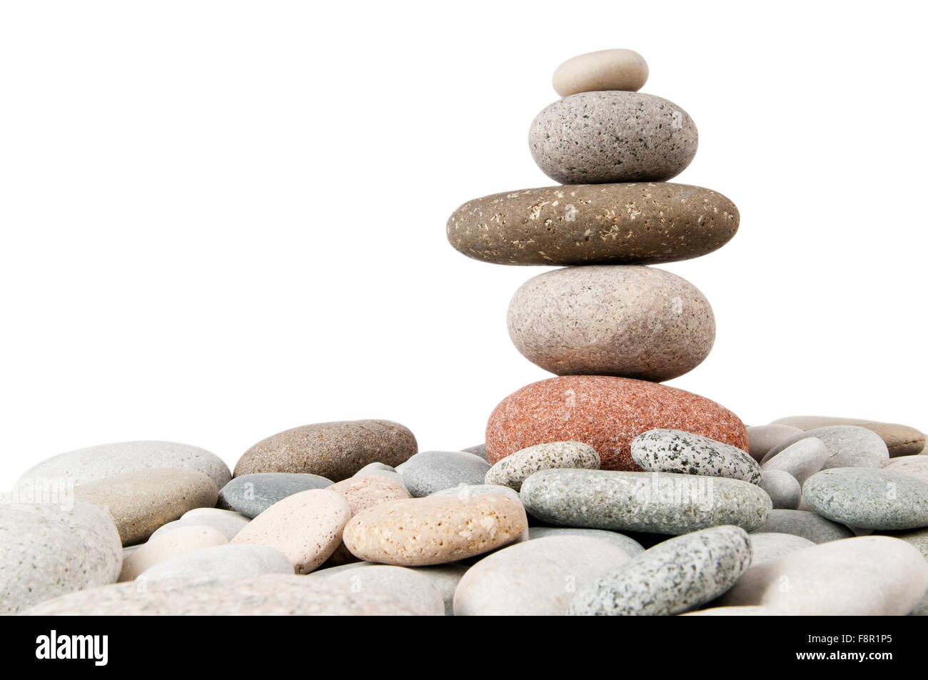 Stack of pebbles isolated on the white Stock Photo - Alamy