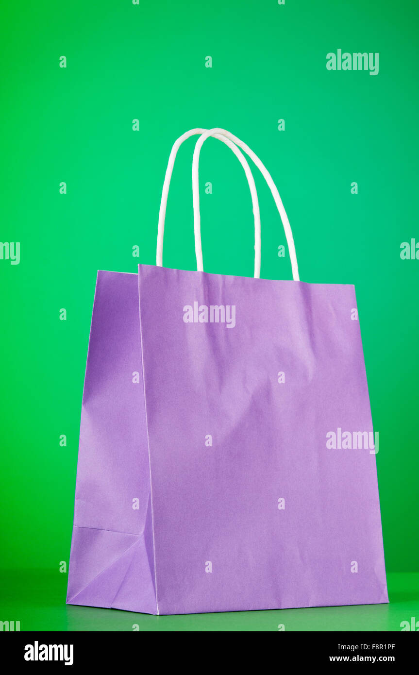Colourful paper shopping bags against gradient background Stock Photo ...