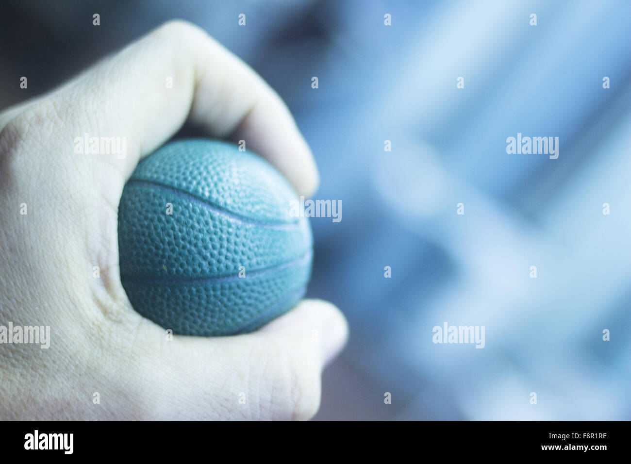 Wrist finger hand strength physiotherapy ball being held and compressed ...