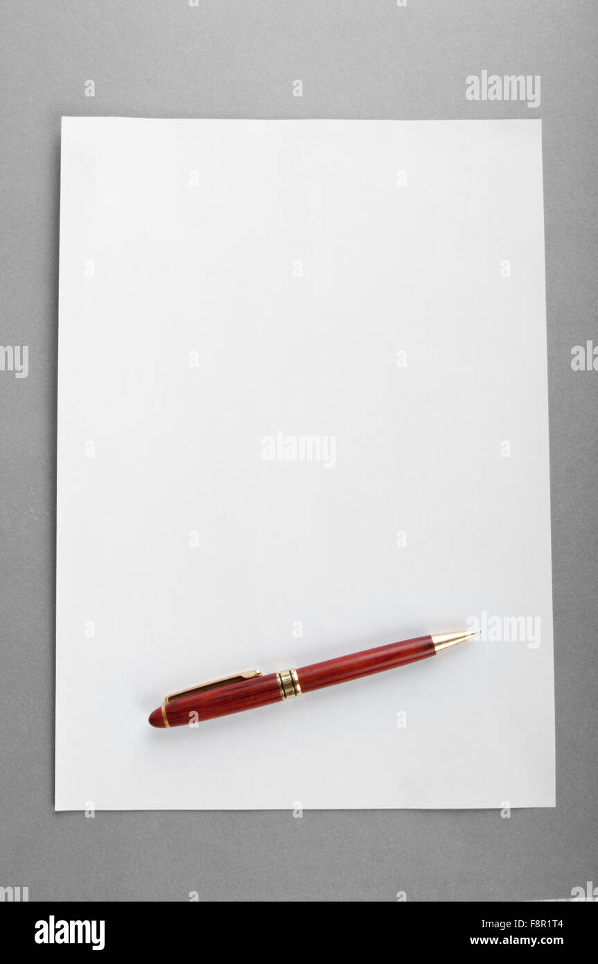 Pen on the sheet of paper Stock Photo - Alamy