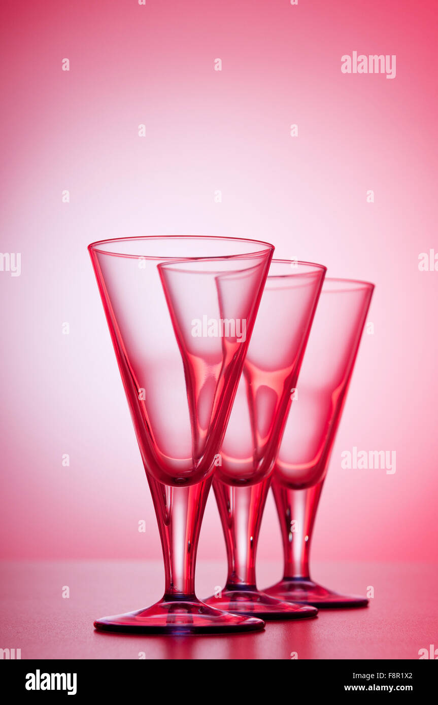 Wine glasses against gradient background Stock Photo - Alamy