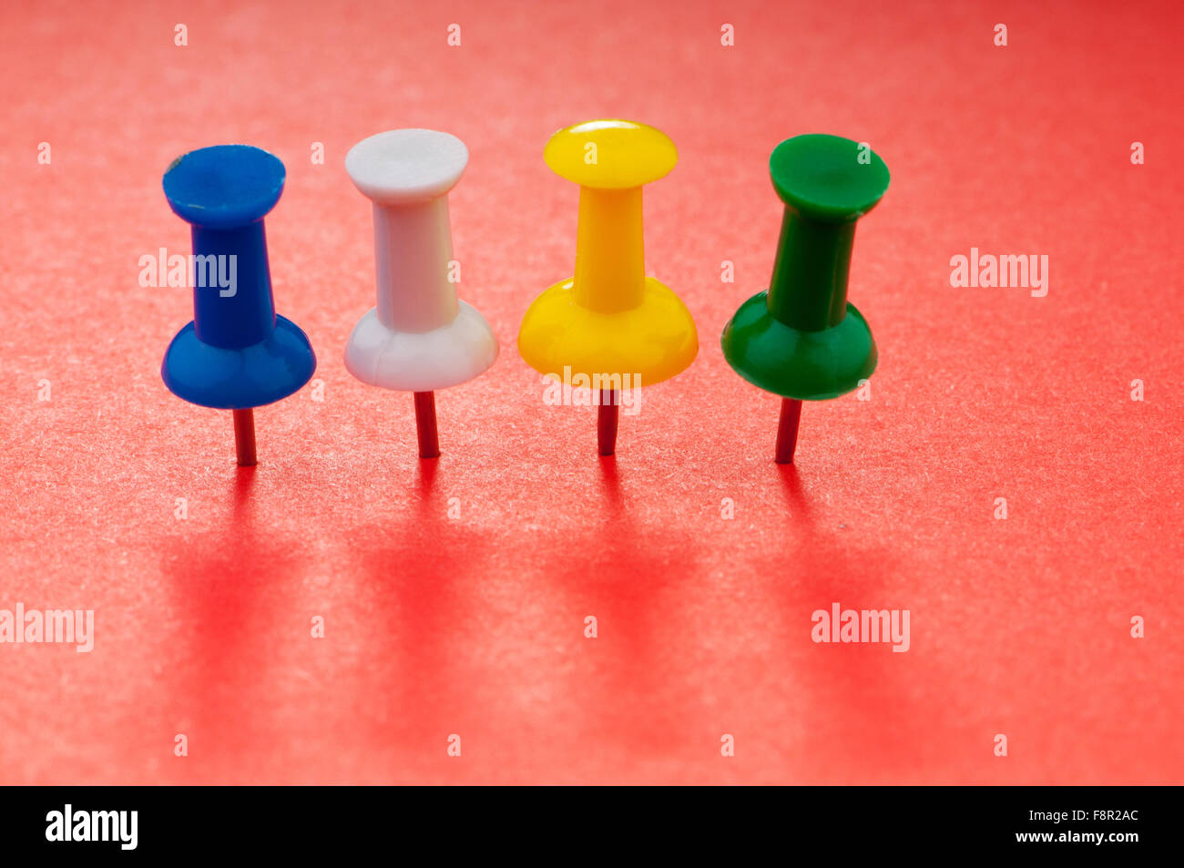 Office pins on the paper Stock Photo - Alamy