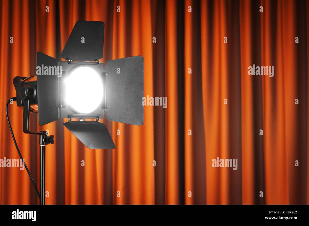 Curtains and projector lights wtih space for your text Stock Photo - Alamy