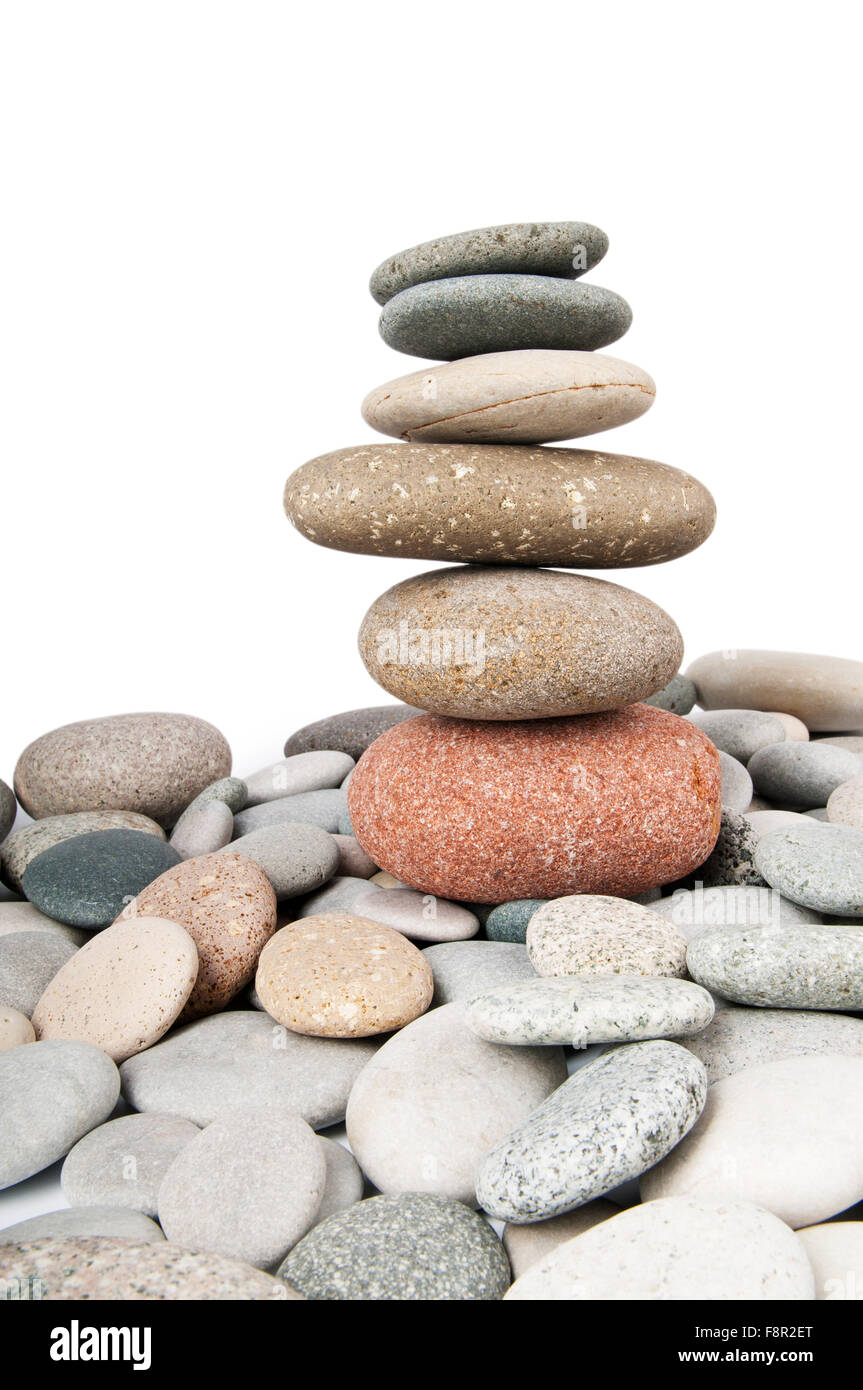 Stack of pebbles isolated on the white Stock Photo - Alamy