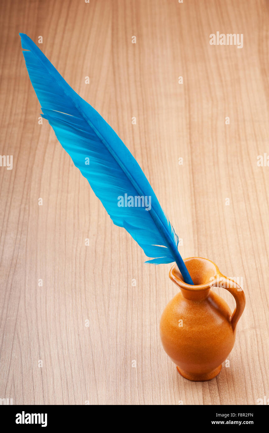 Writing feather against gradient background Stock Photo - Alamy