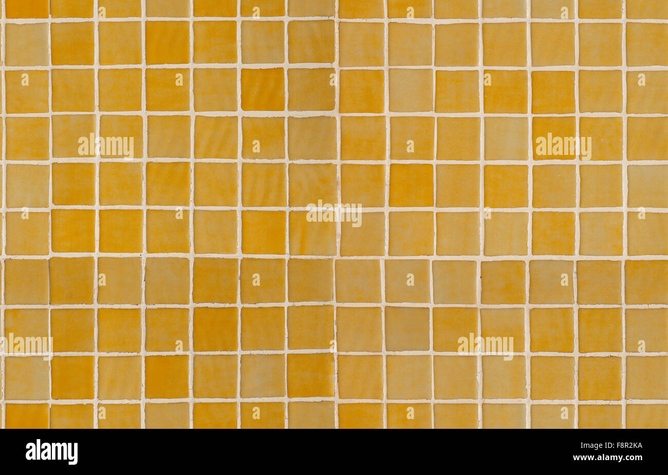 Close-up of decorative yellow glazed tile. Tileable texture Stock Photo ...