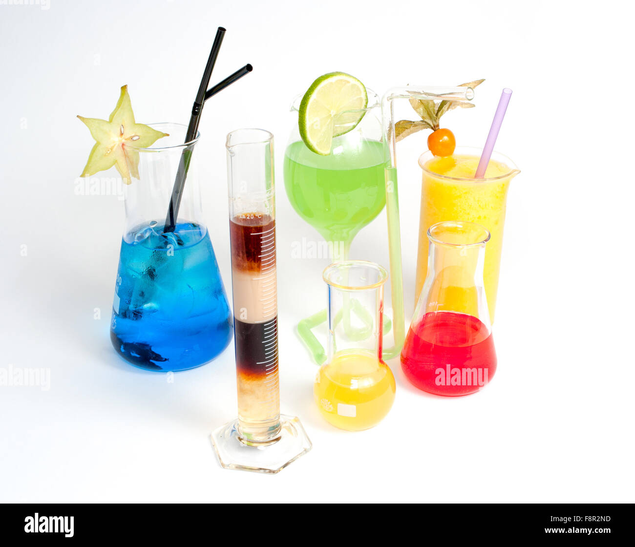 close-up of six chemistry glass containers filled with colorful ...