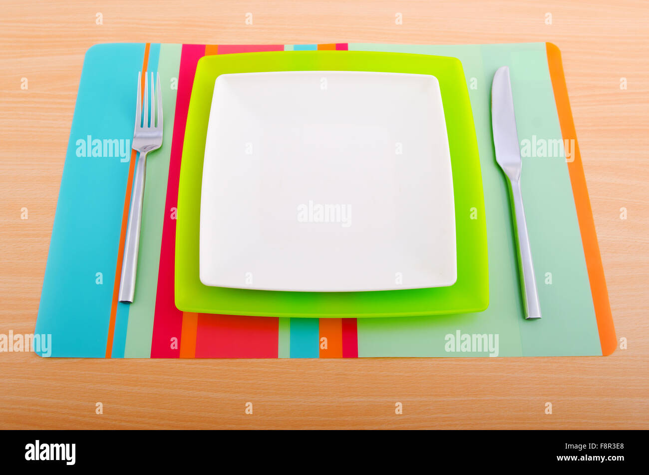Empty plate with utensils Stock Photo - Alamy