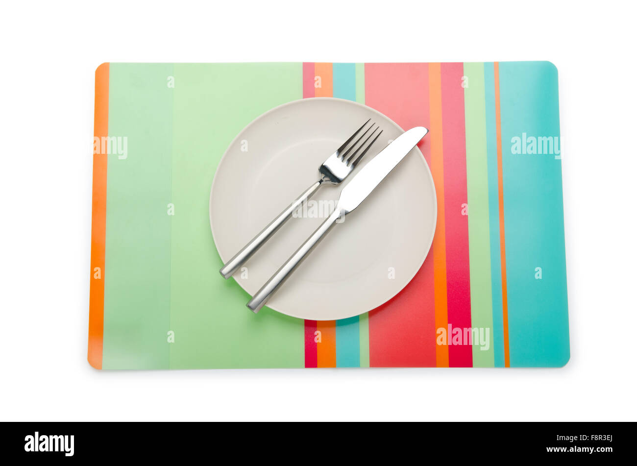Plate and utensils served on table Stock Photo - Alamy
