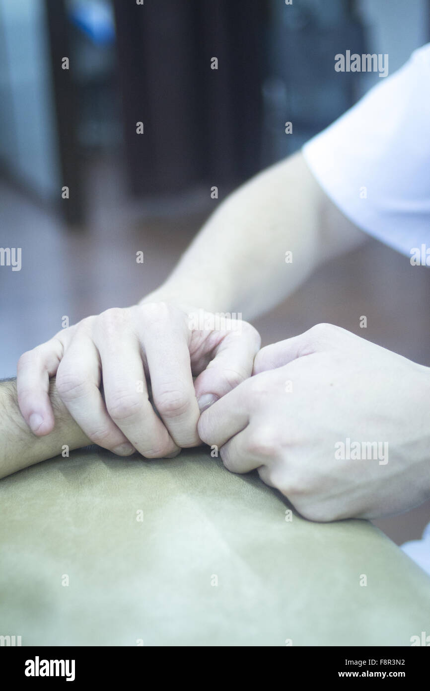 Patient hand in physical therapy physiotherapy clinic in medical center ...