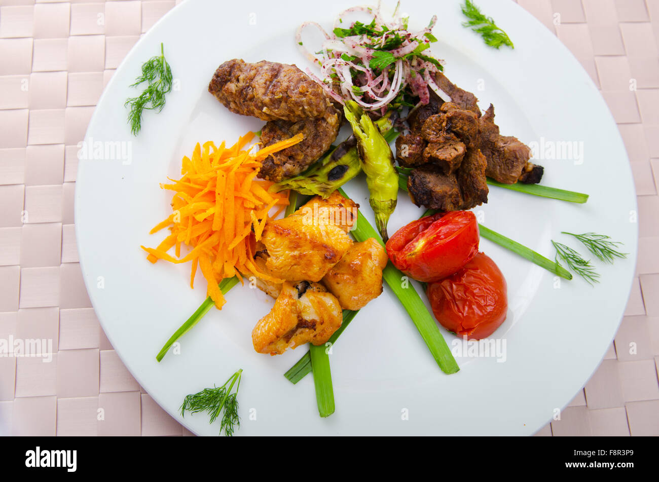 Plate with tasty lamp kebabs Stock Photo - Alamy
