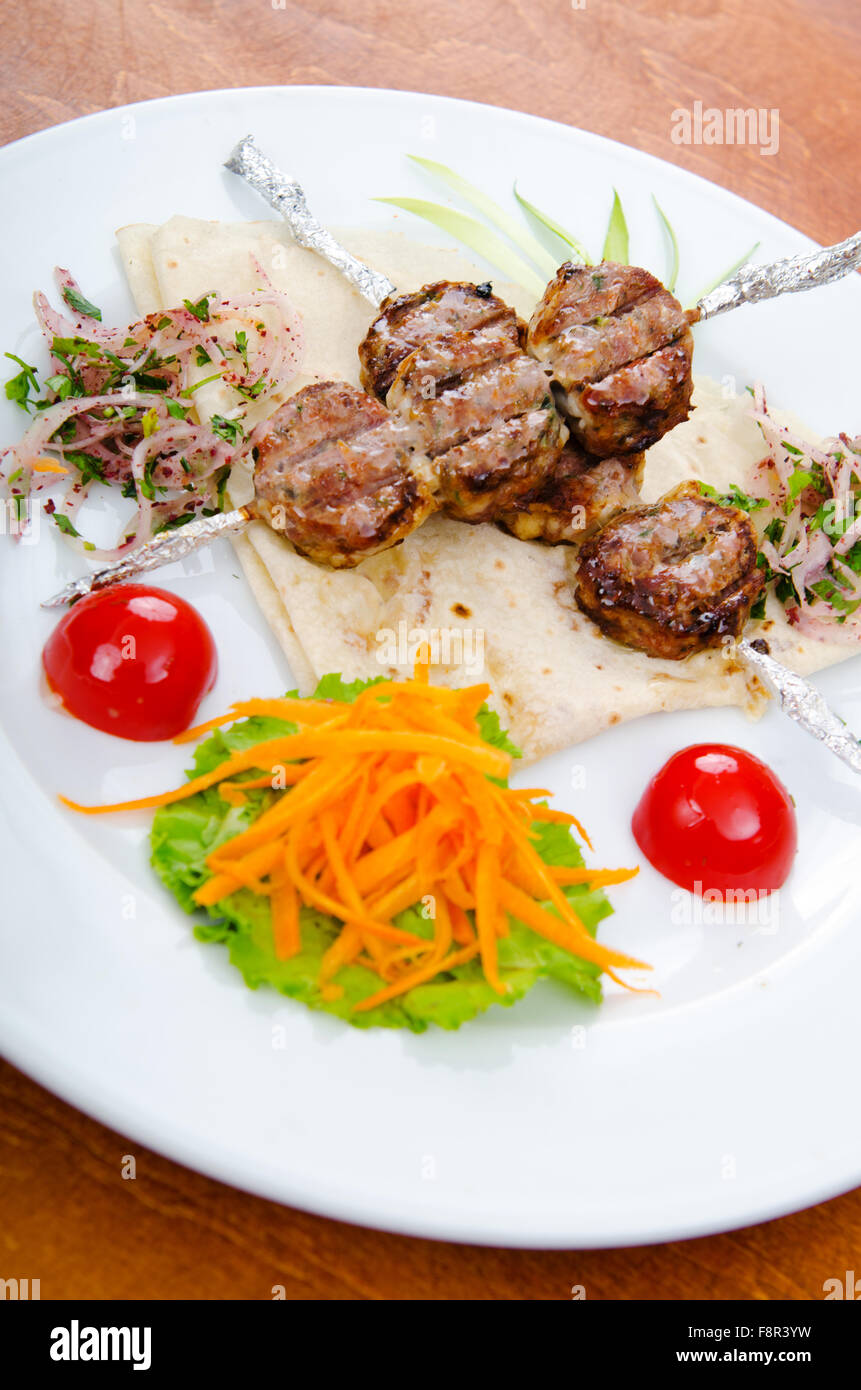 Meat cuisine - kebab served in plate Stock Photo - Alamy