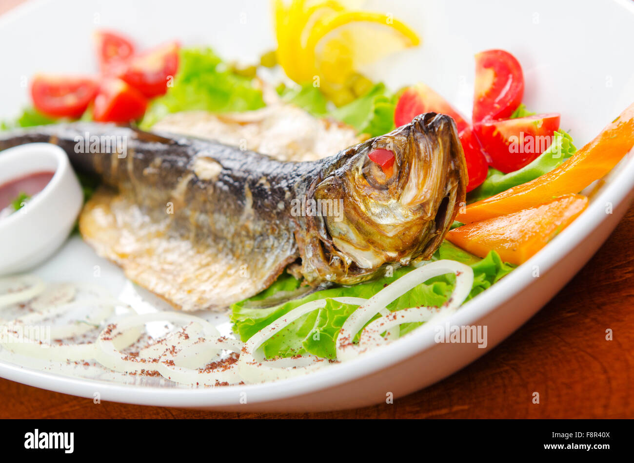 Fried fish in the plate Stock Photo - Alamy