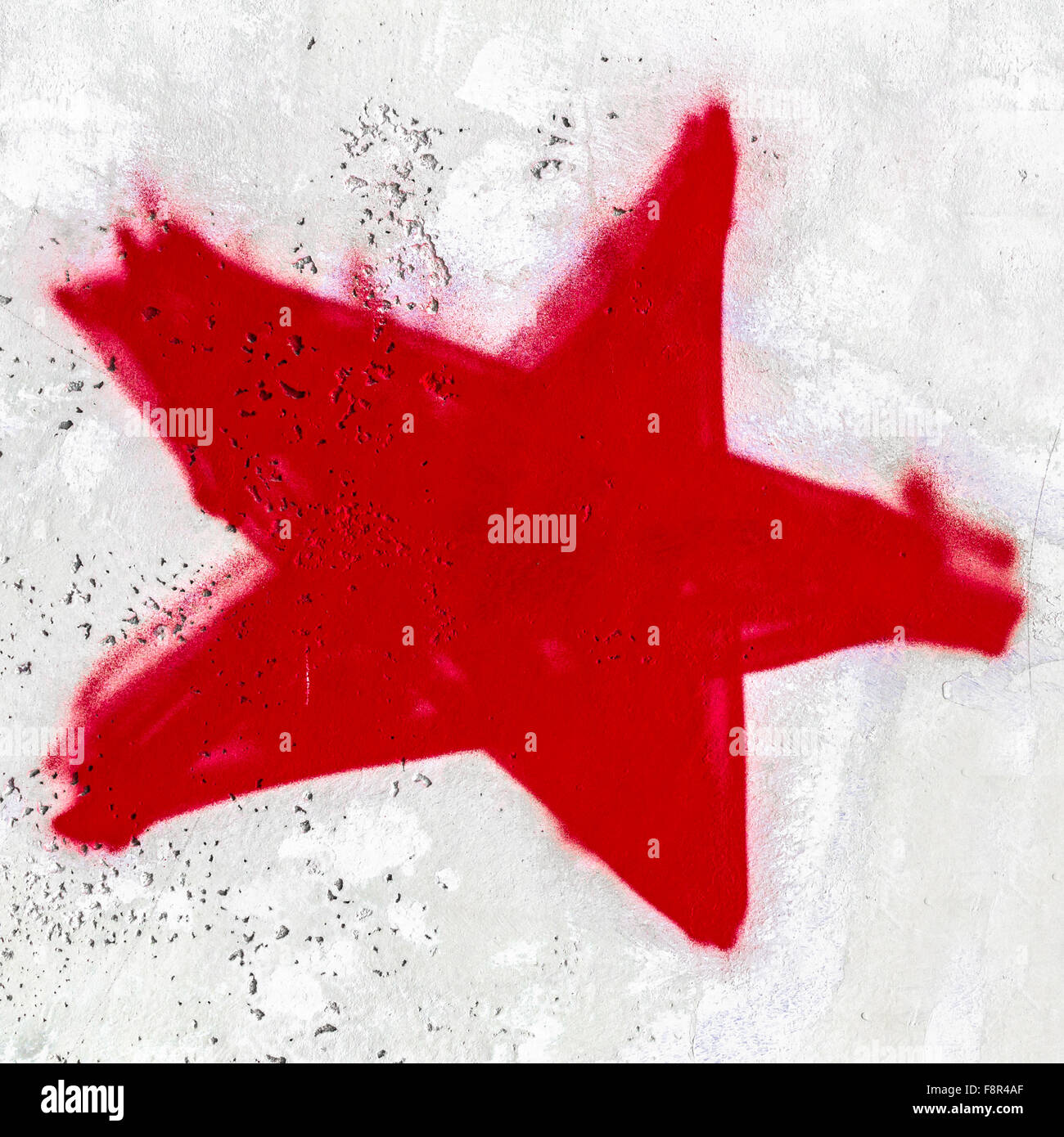 A red star painted on the wall with spray paint Stock Photo - Alamy
