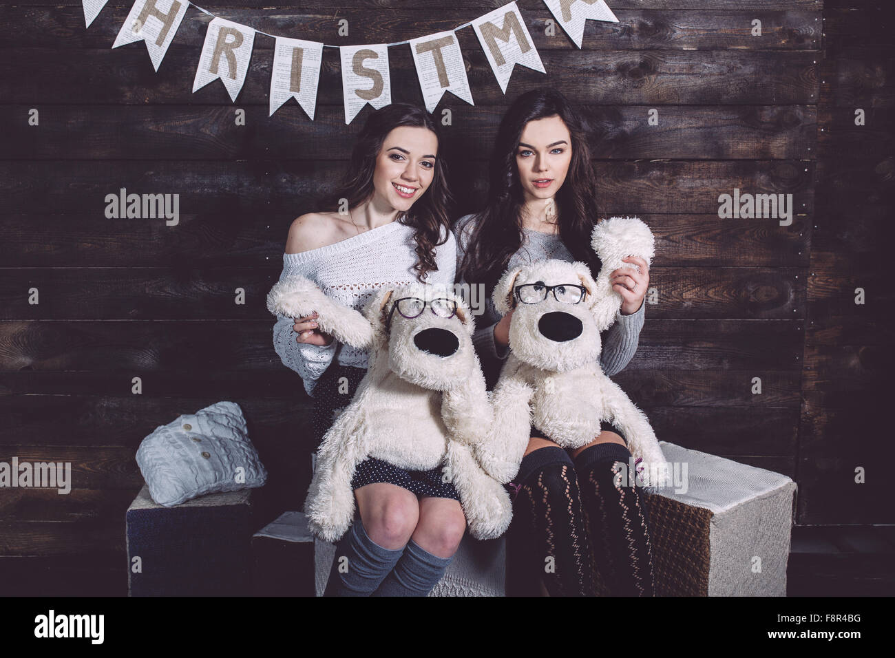 Two charming girls playing Stock Photo - Alamy