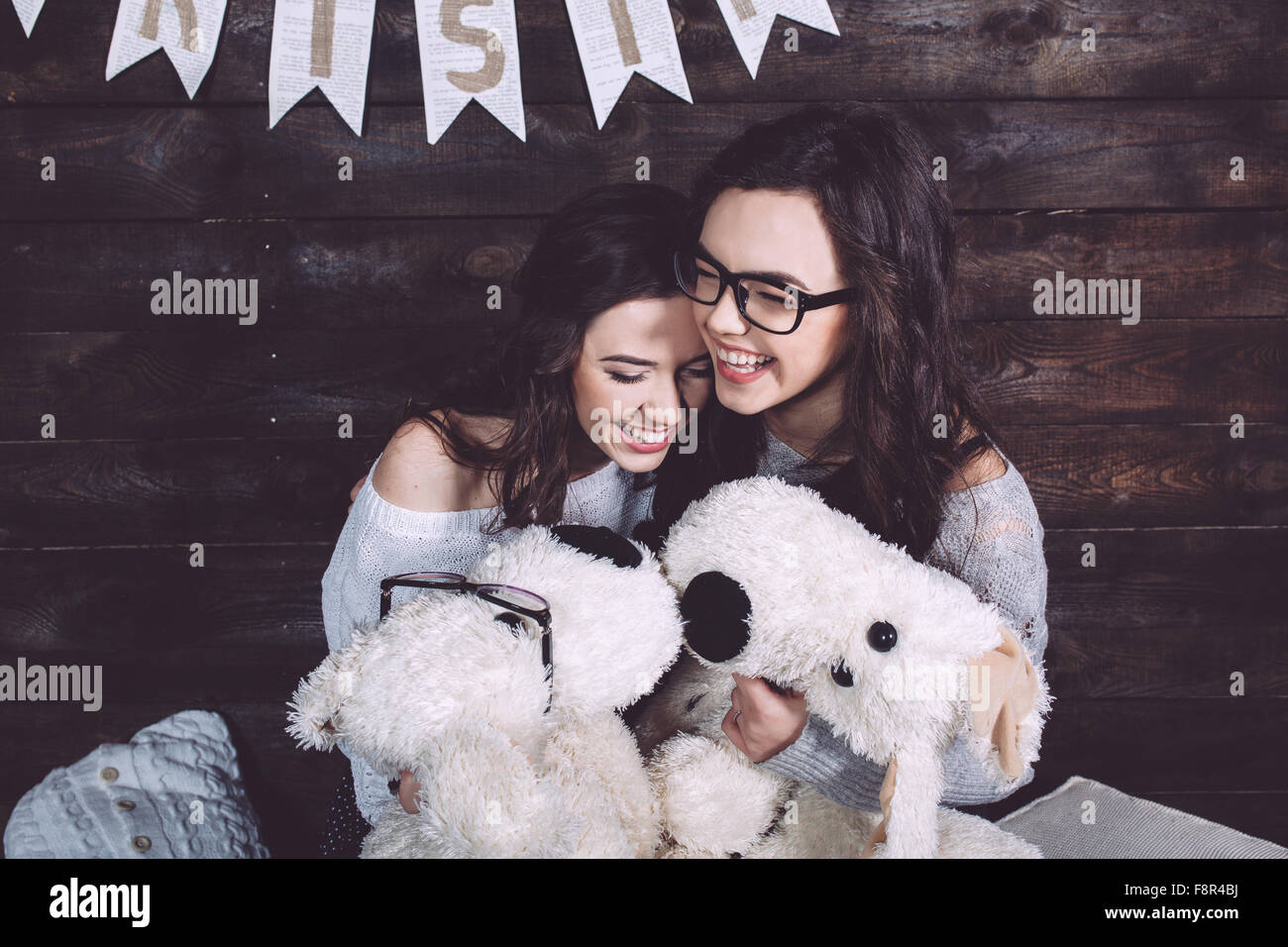 Two charming girls playing Stock Photo - Alamy