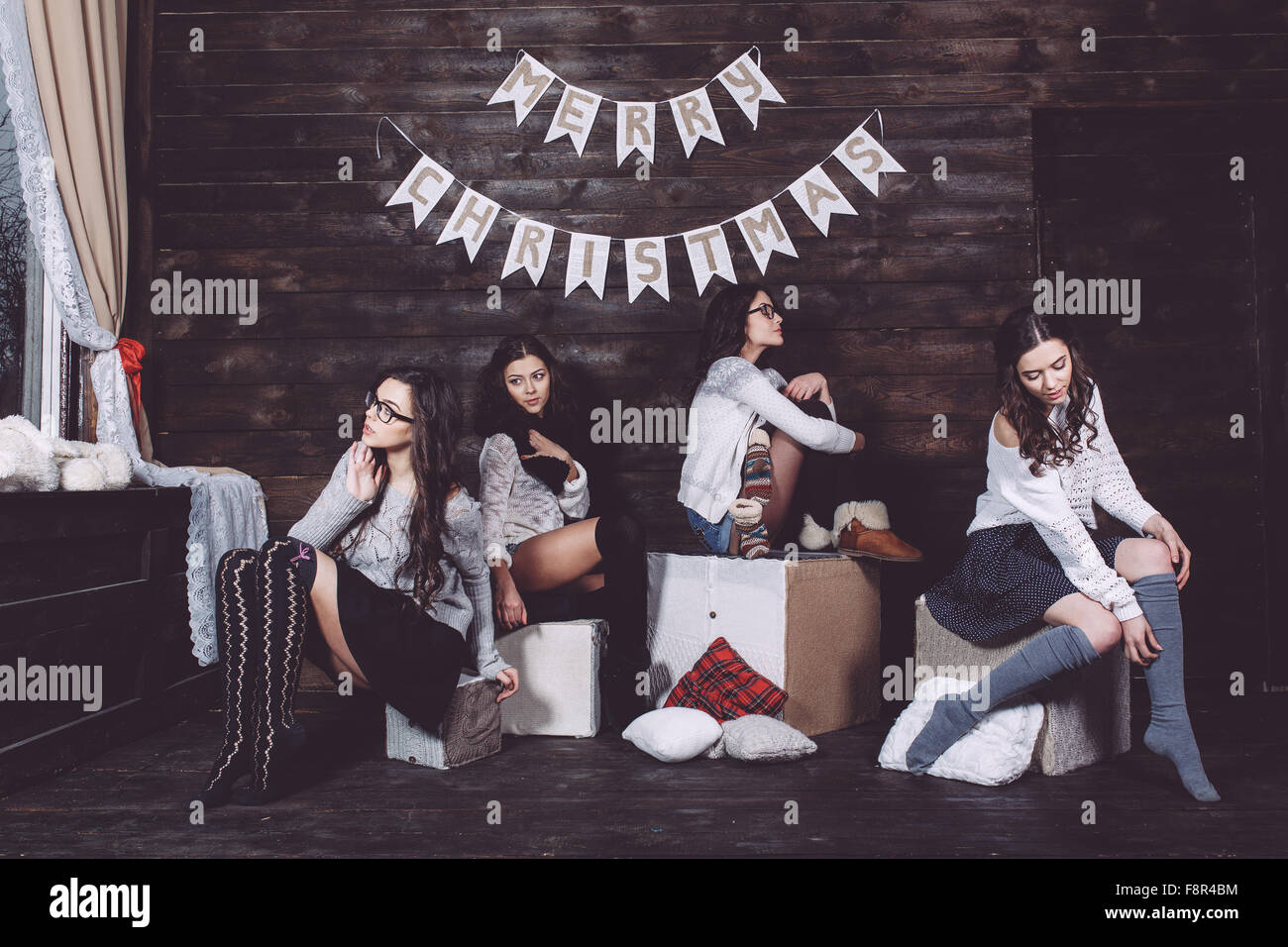 Four charming model posing Stock Photo - Alamy