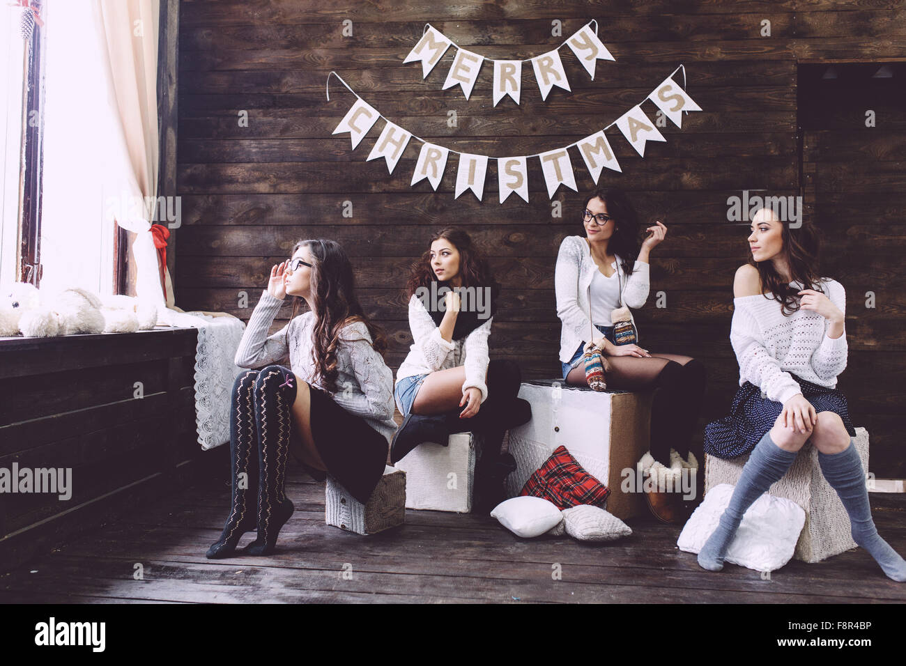 Four charming model posing Stock Photo - Alamy