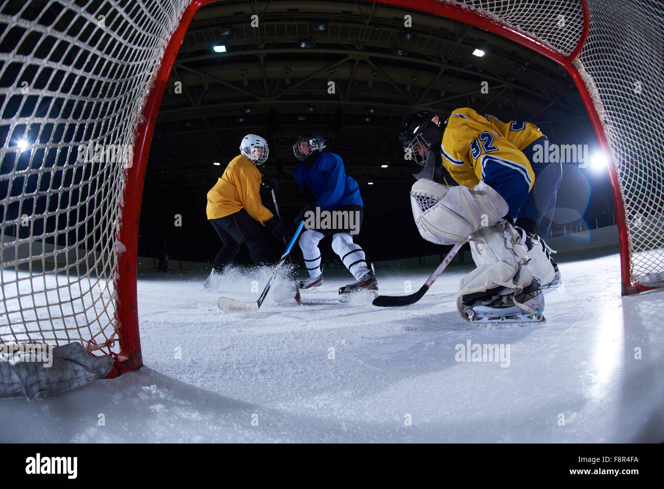 ice hockey goalkeeper player on goal in action Stock Photo - Alamy