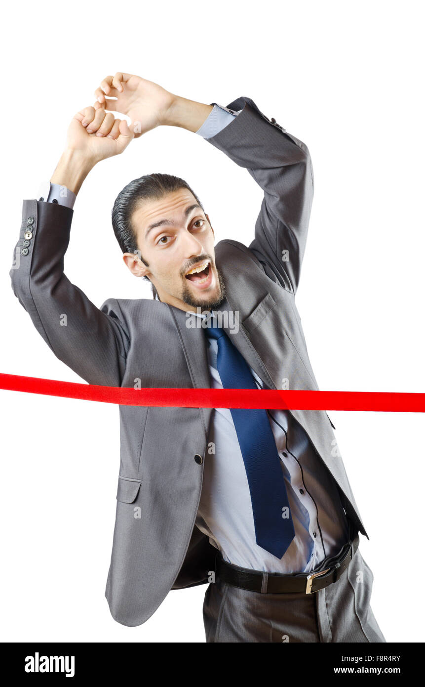 Businessman crossing finish line Stock Photo - Alamy