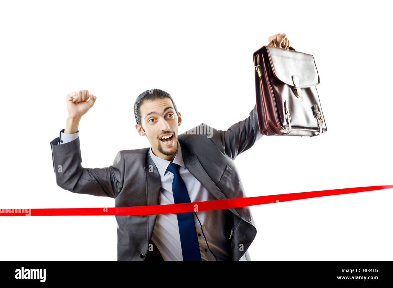 Businessman crossing finish line Stock Photo - Alamy