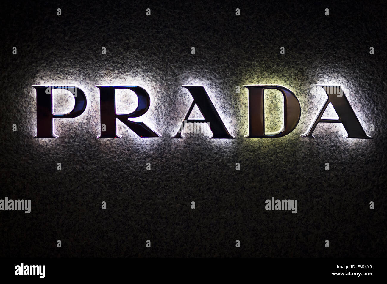 Prada neon light logo shop fashion clothes store at night in high ...