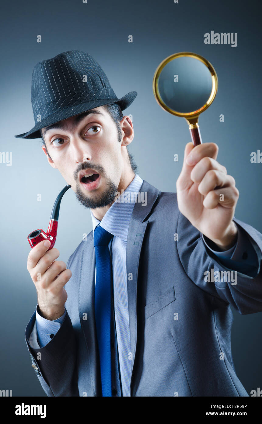Detective with the smoking pipe Stock Photo - Alamy
