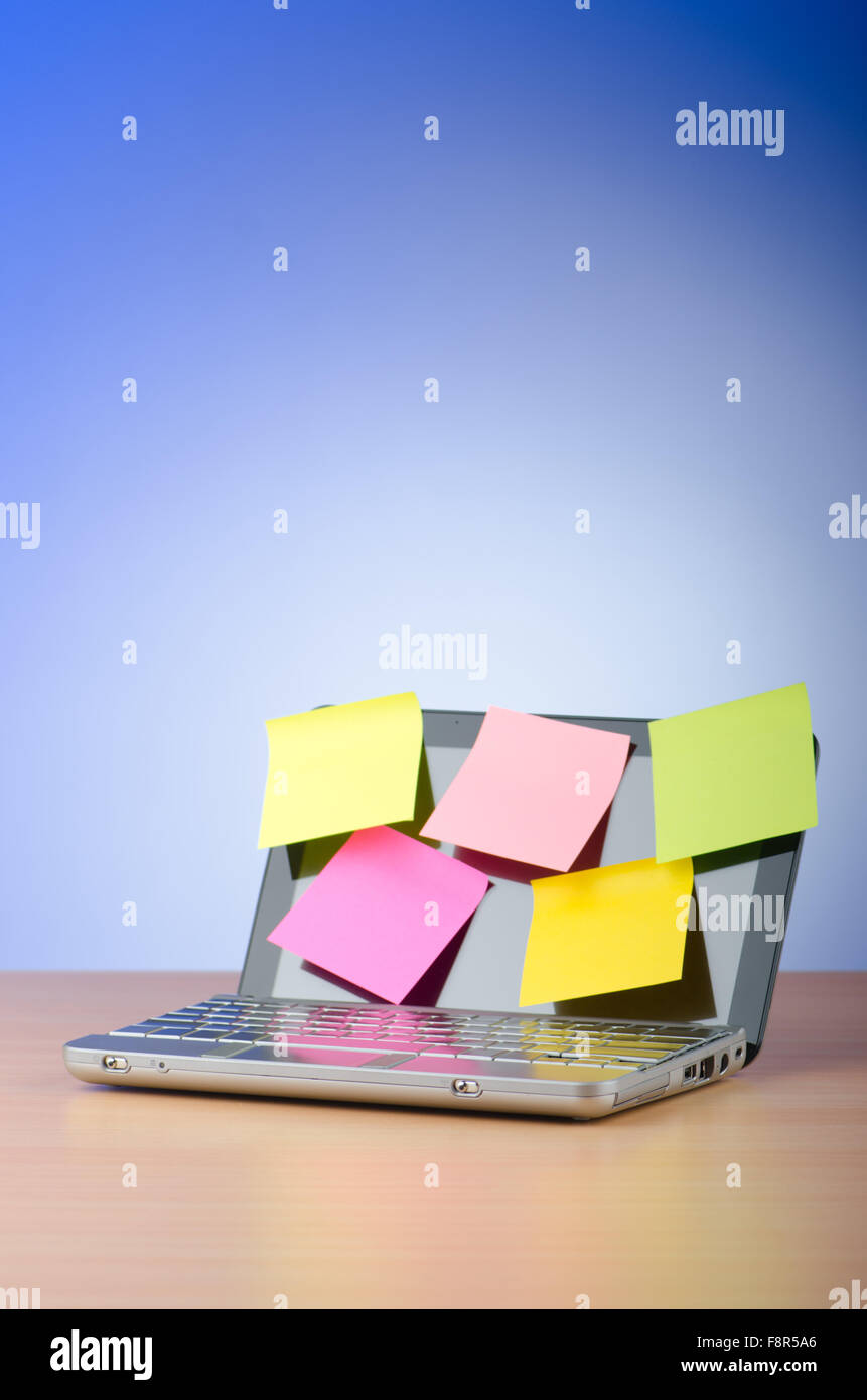 Netbook with reminder notes Stock Photo - Alamy