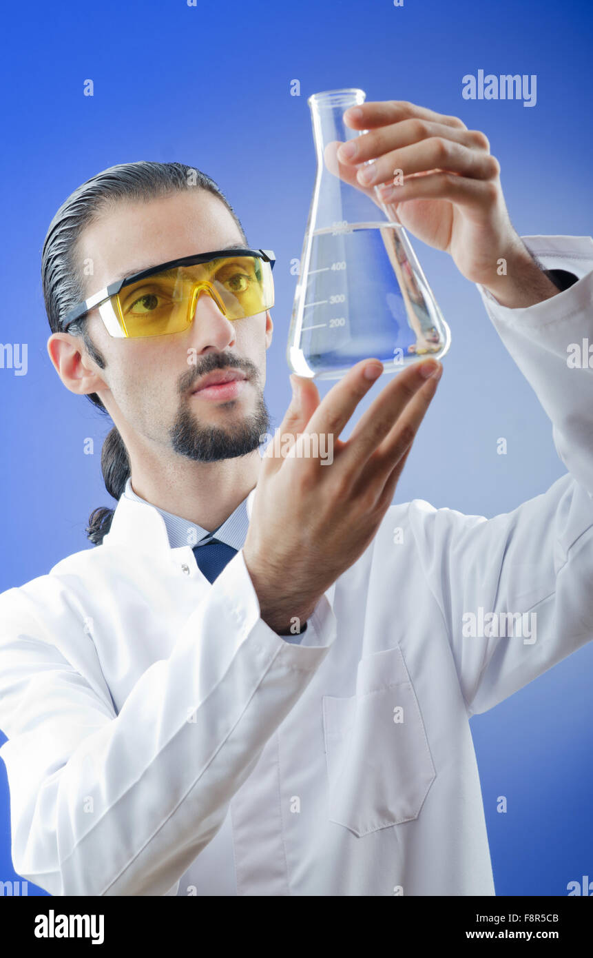 Young chemist student working in lab Stock Photo - Alamy
