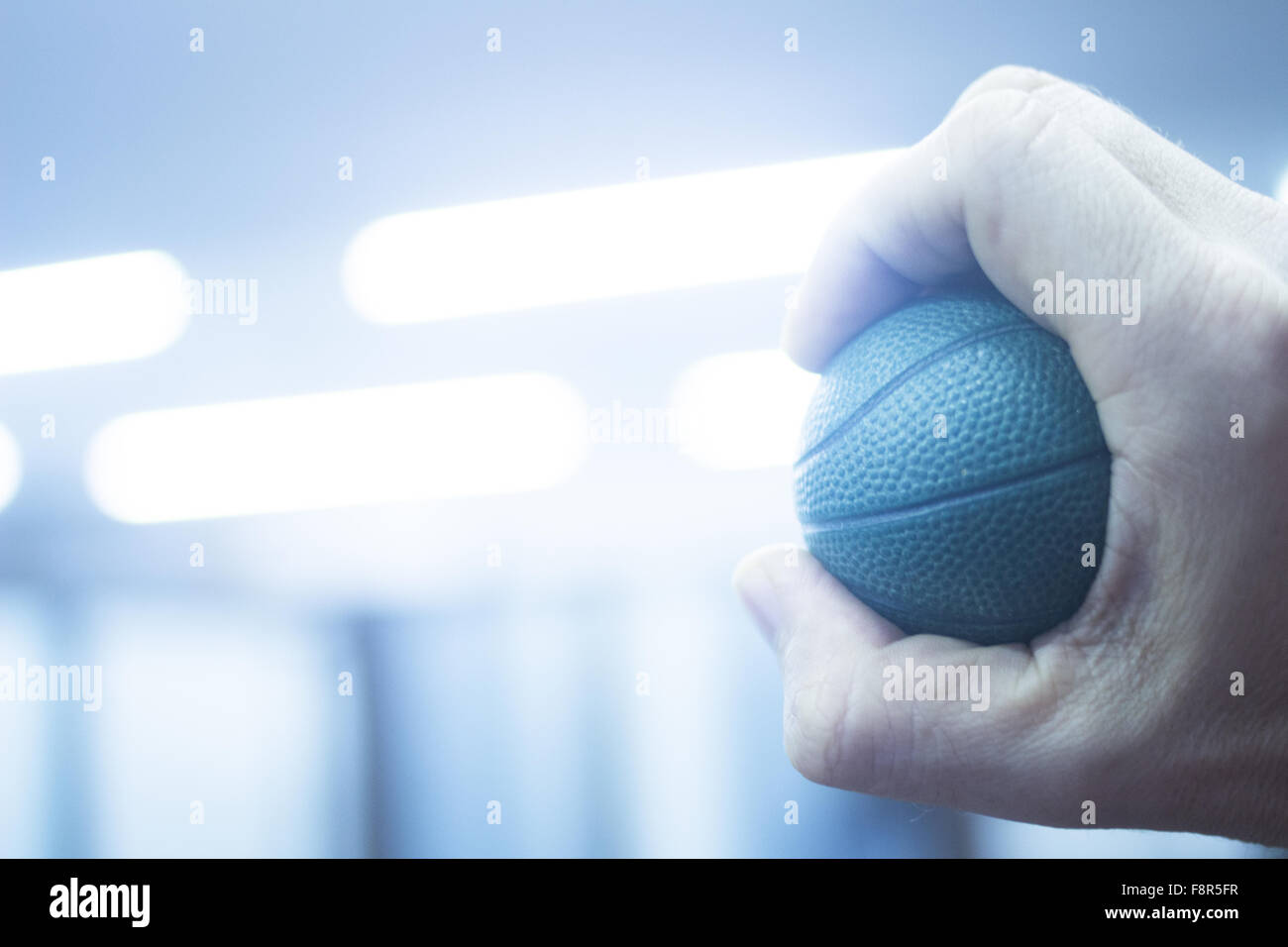 Wrist finger hand strength physiotherapy ball being held and compressed ...