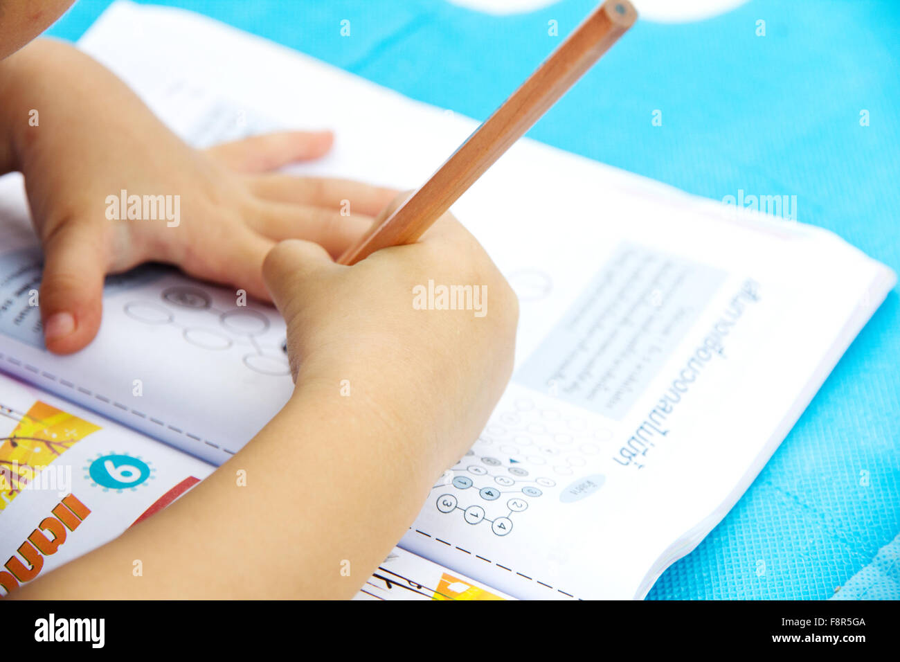 Little girl doing homework Stock Photo - Alamy
