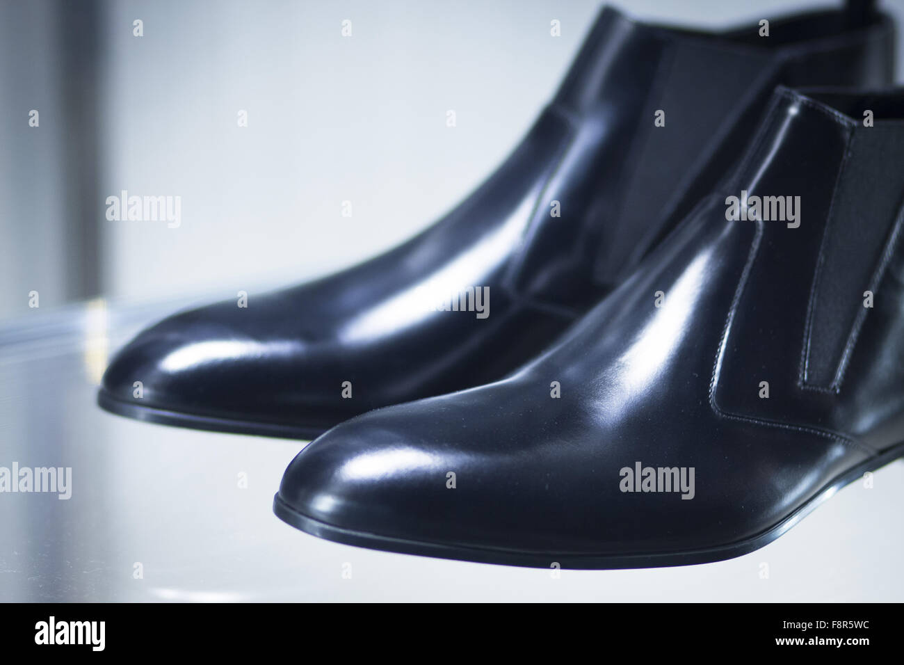 Shop window fashion store designer luxury leather shiny polished shoes ...