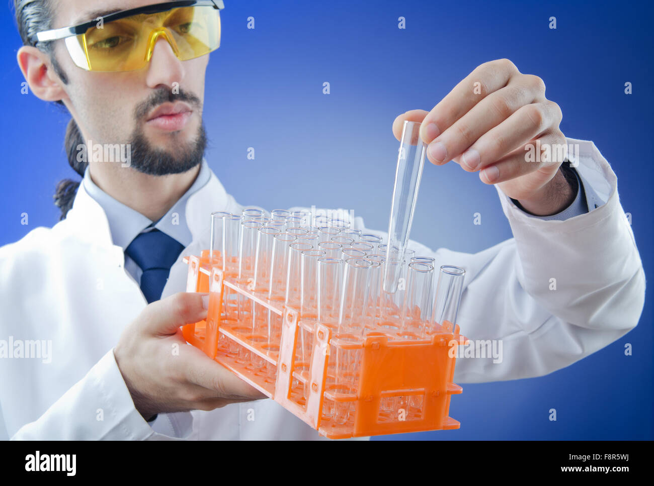 Young chemist student working in lab Stock Photo - Alamy