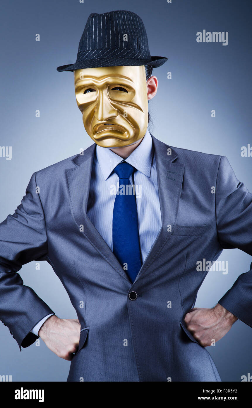 Businessman with mask concealing his identity Stock Photo - Alamy