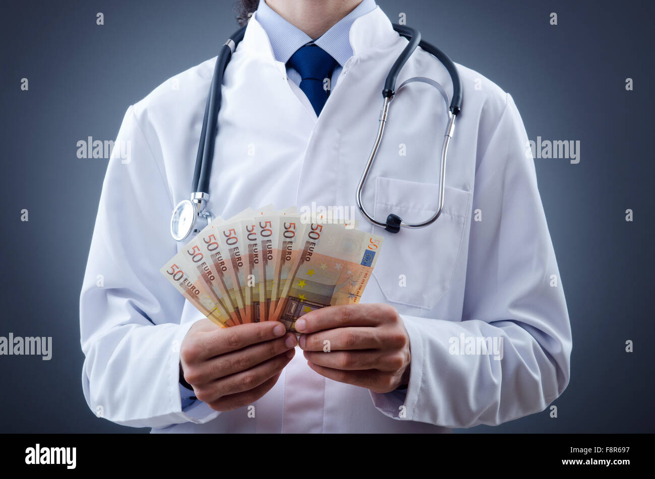Doctor with euro money Stock Photo - Alamy