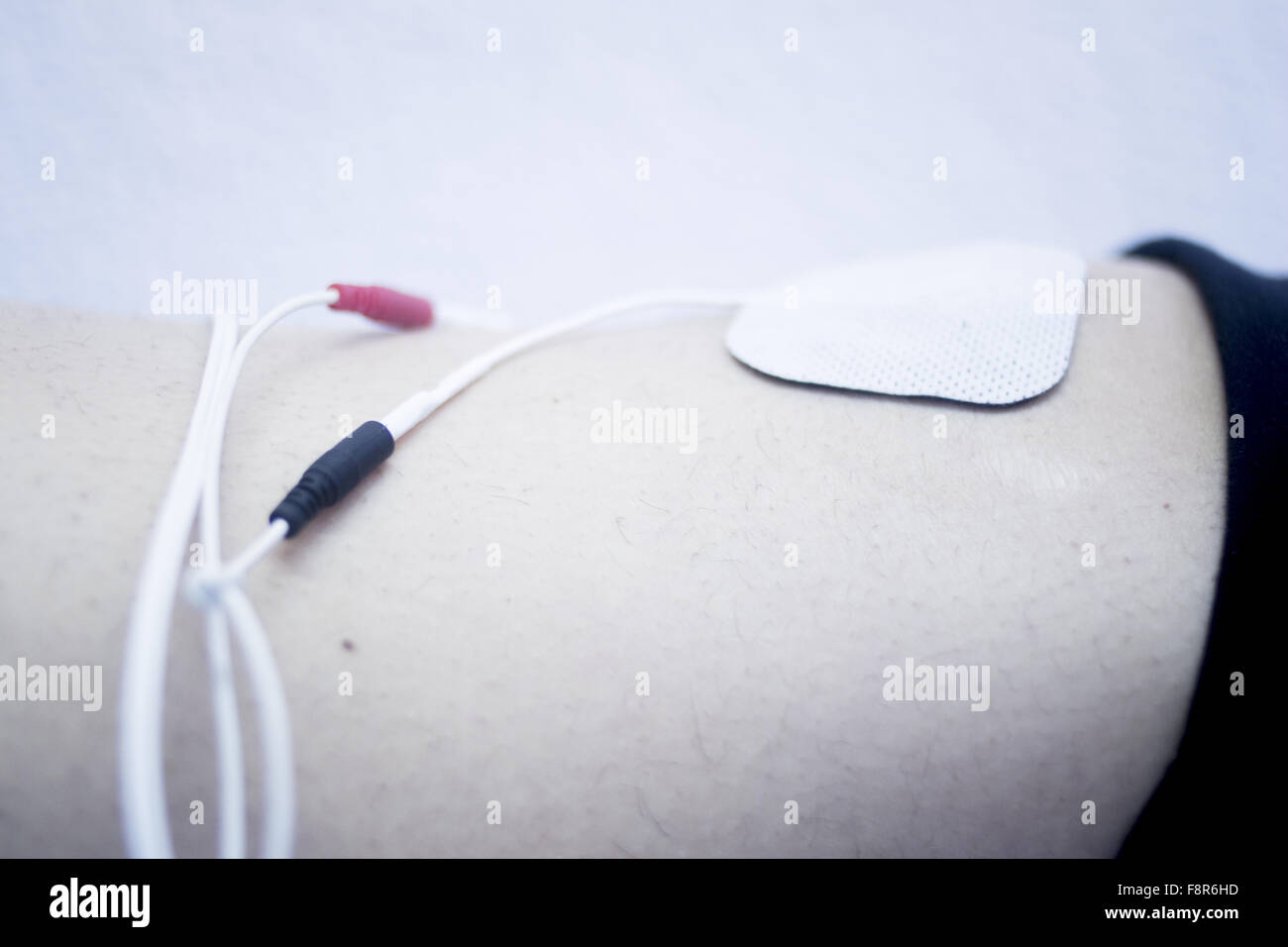 Patient leg and knee in electro physiotherapy electrical impulse ...