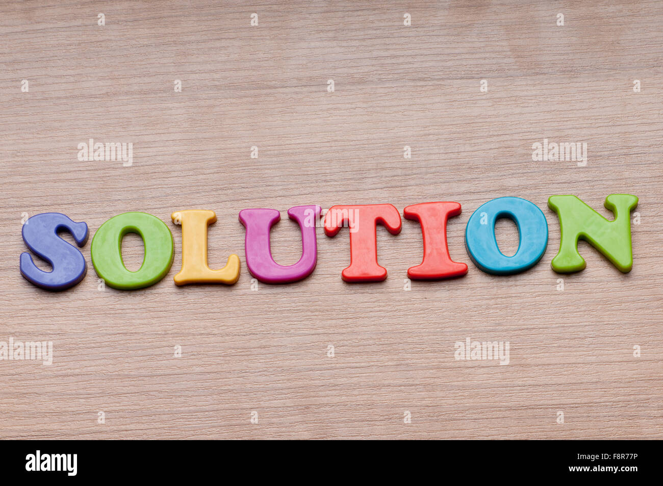 Solution concept with letters background Stock Photo - Alamy
