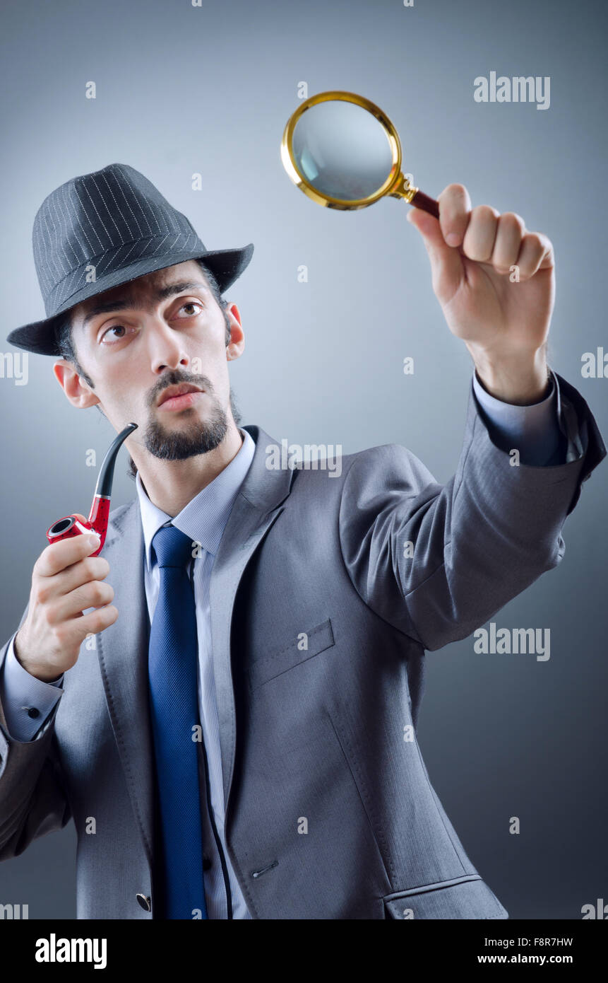 Detective with the smoking pipe Stock Photo - Alamy