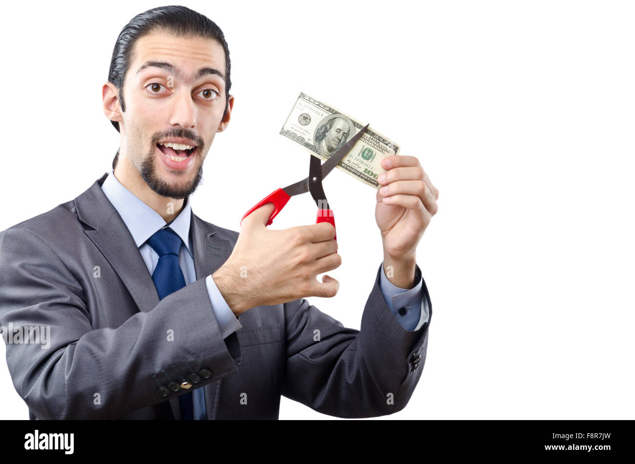 Man cutting money on white Stock Photo - Alamy