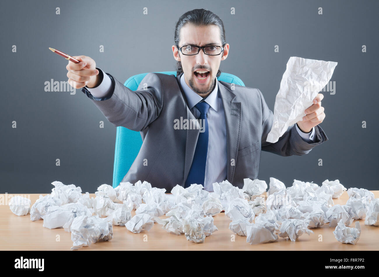 Businessman throwing paper away Stock Photo - Alamy